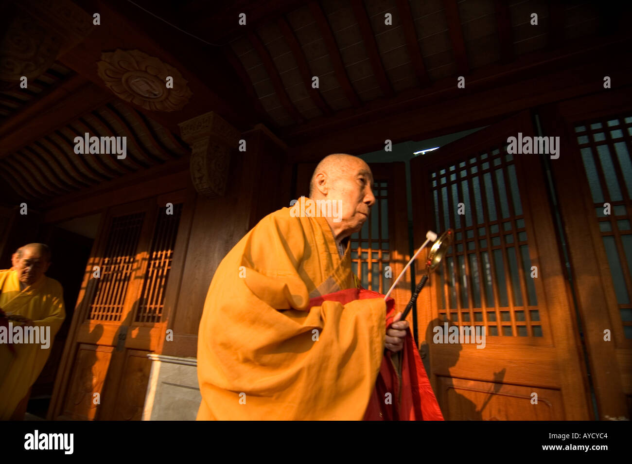 An old Buddhist monk during a religious procession at Jingan Temple, in ...