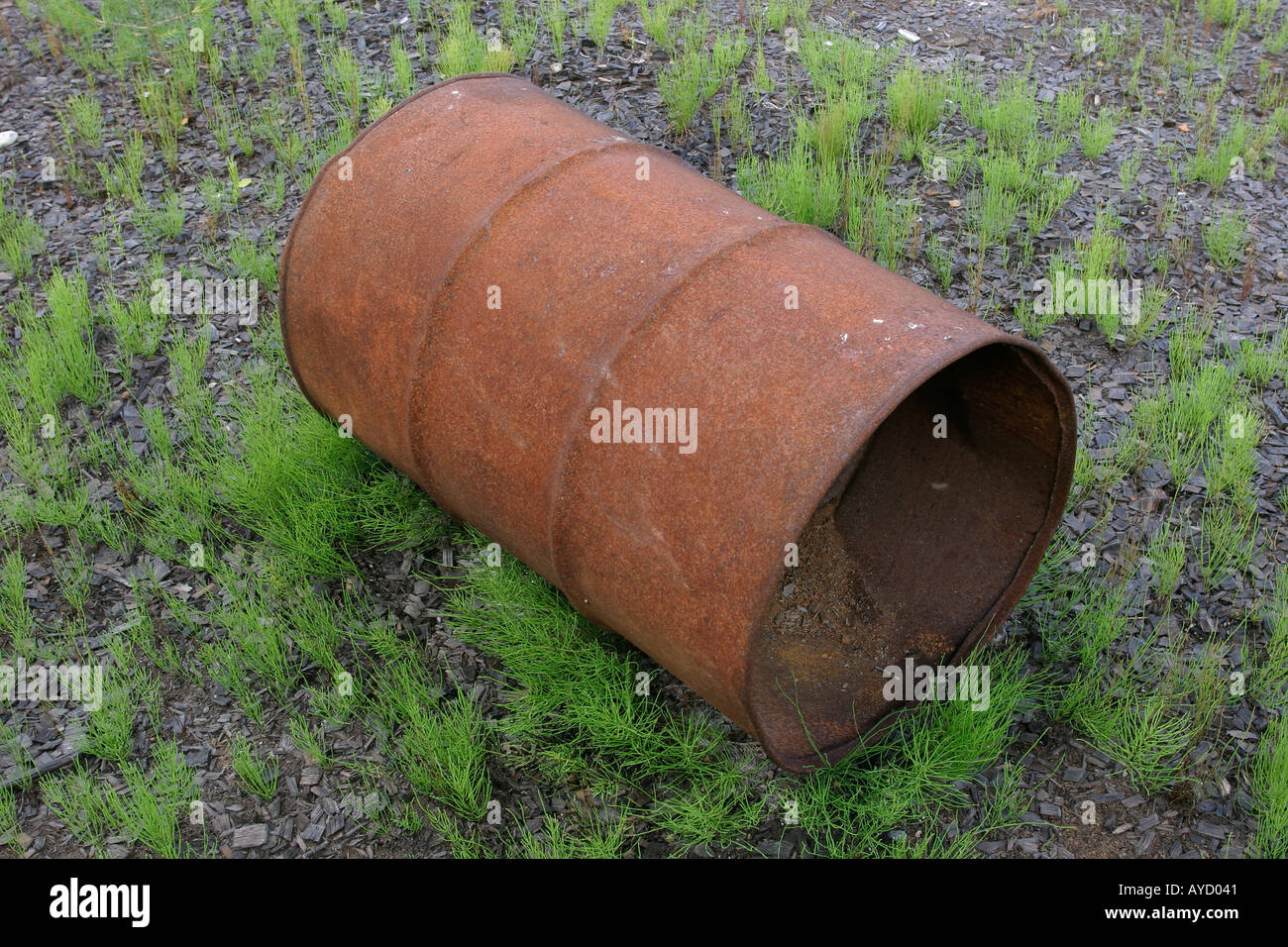 rusty barrel on ground Stock Photo - Alamy