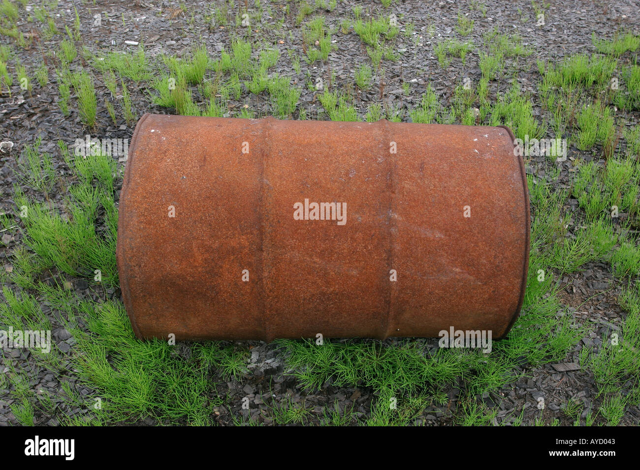 rusty barrel on ground Stock Photo - Alamy
