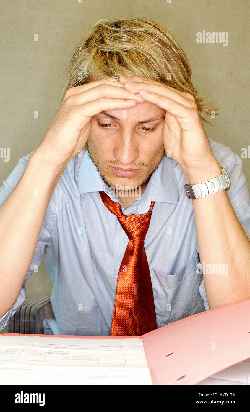 Stressed looking office worker Stock Photo - Alamy