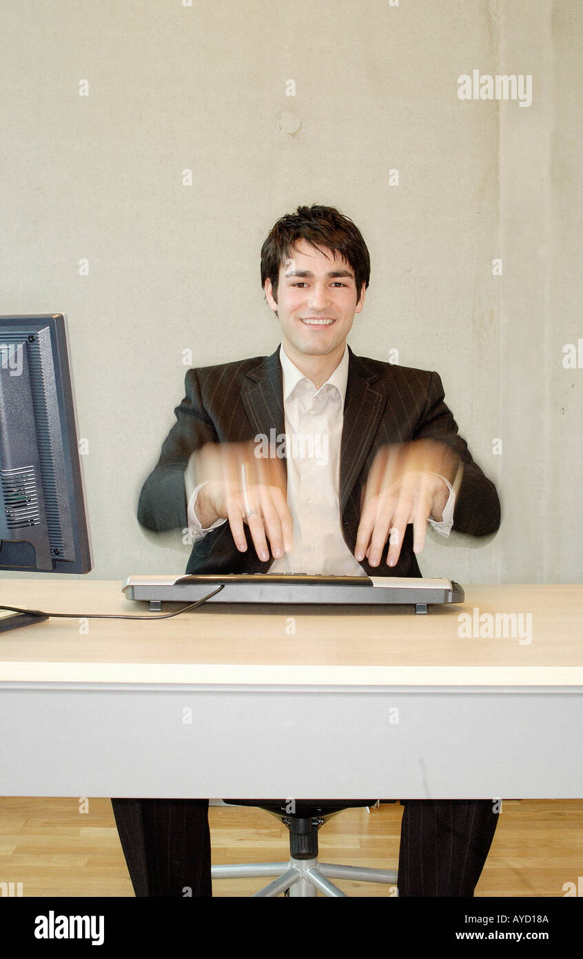 Businessman typing fast Stock Photo - Alamy