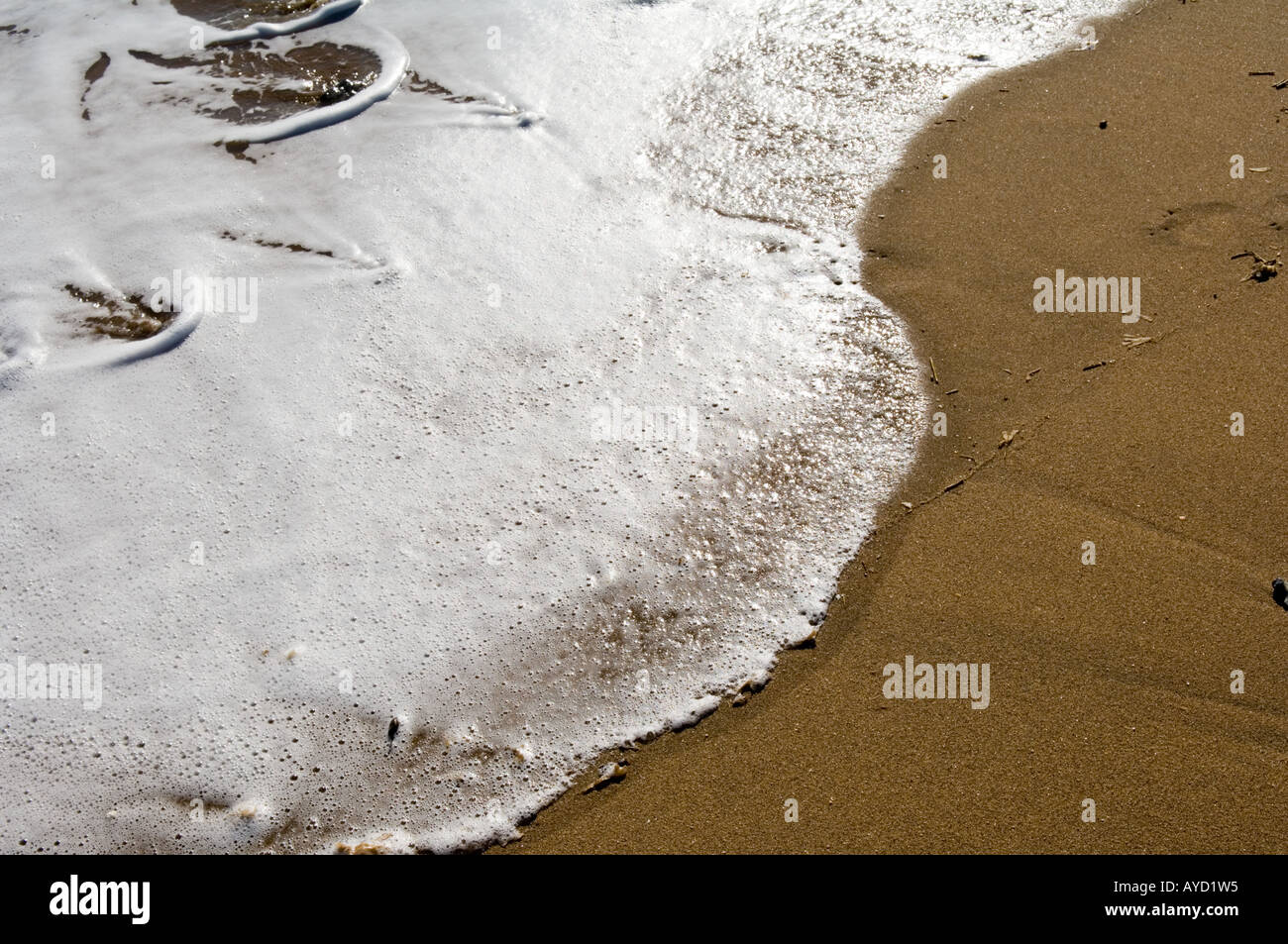 Tide rolling in on a Kent beach Stock Photo - Alamy