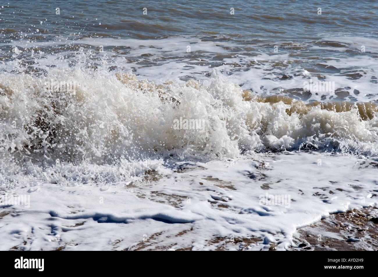Big tide rolling in on a Kent beach Stock Photo - Alamy