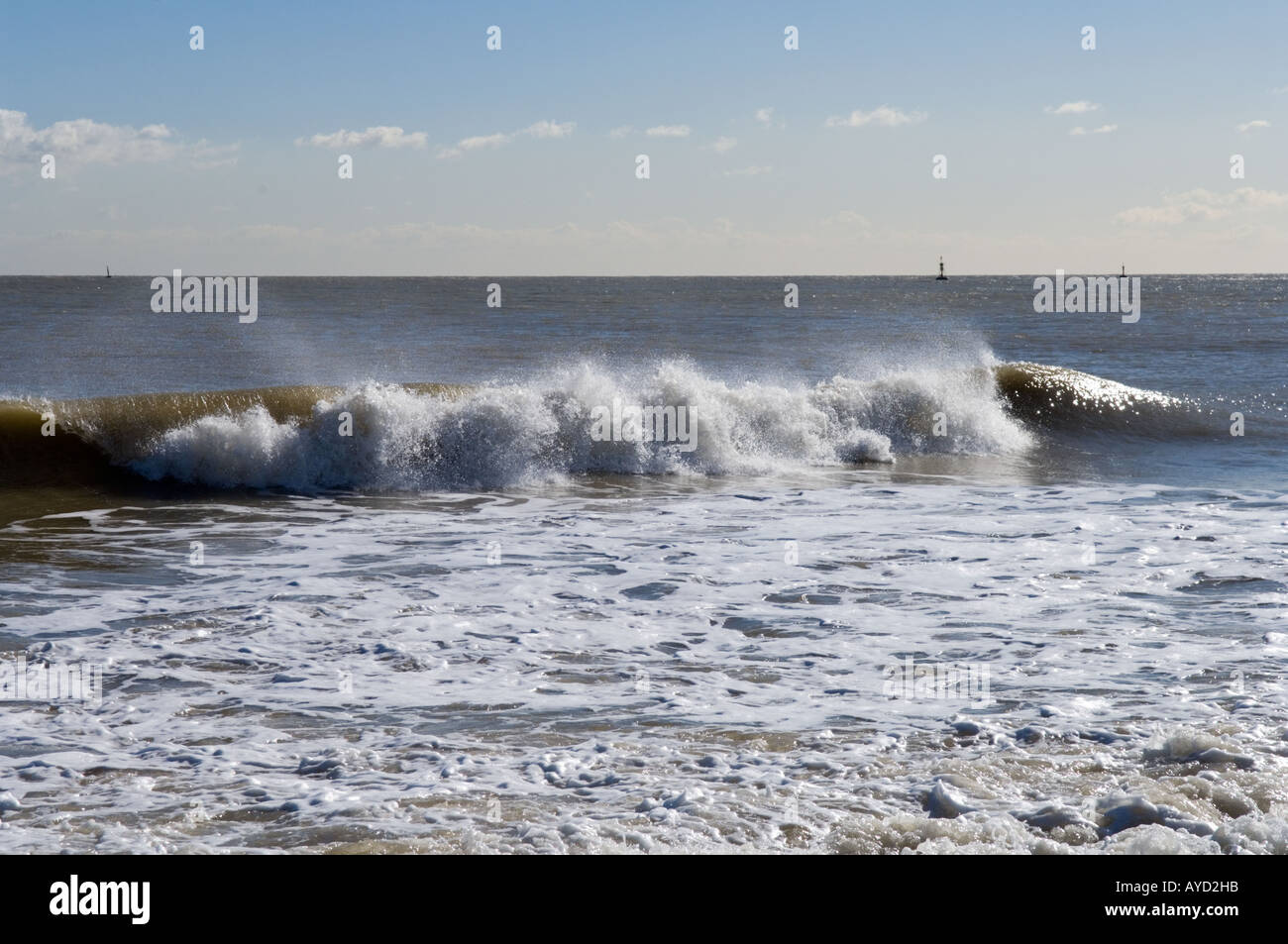 Big tide rolling in on a Kent beach Stock Photo - Alamy