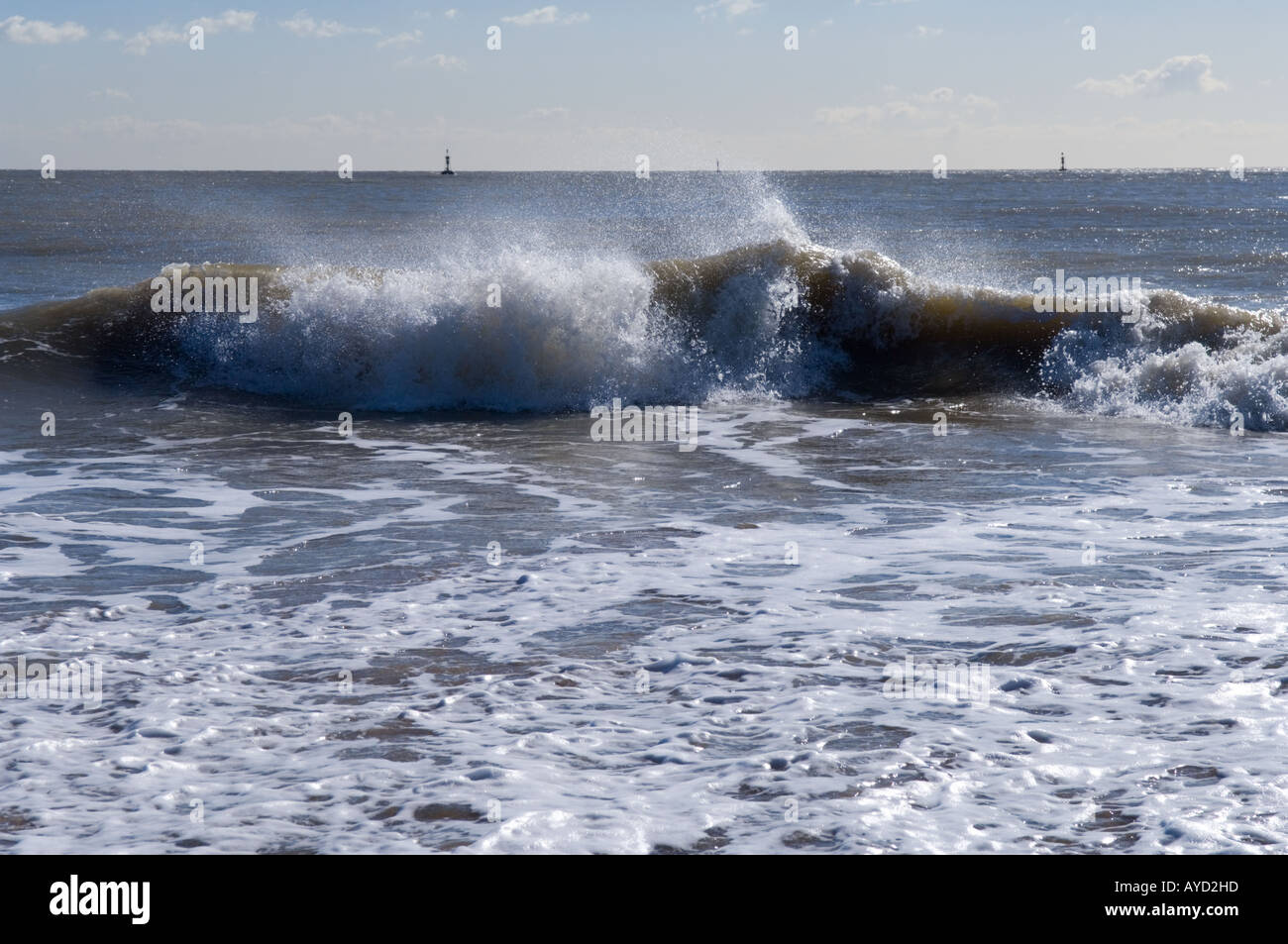 Big tide rolling in on a Kent beach Stock Photo - Alamy
