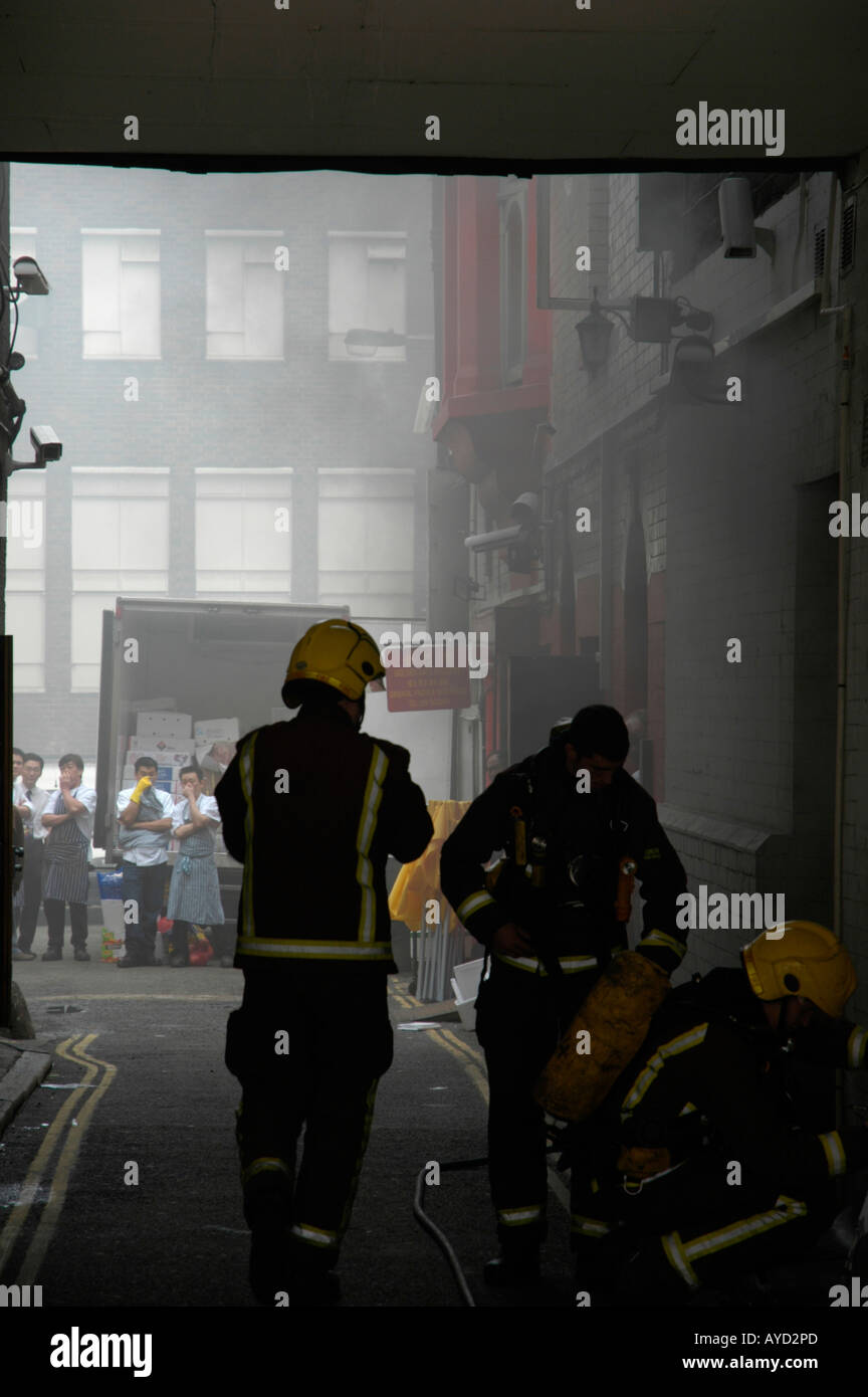 Fire officers about to enter a burning restaurant in London's Chinatown ...