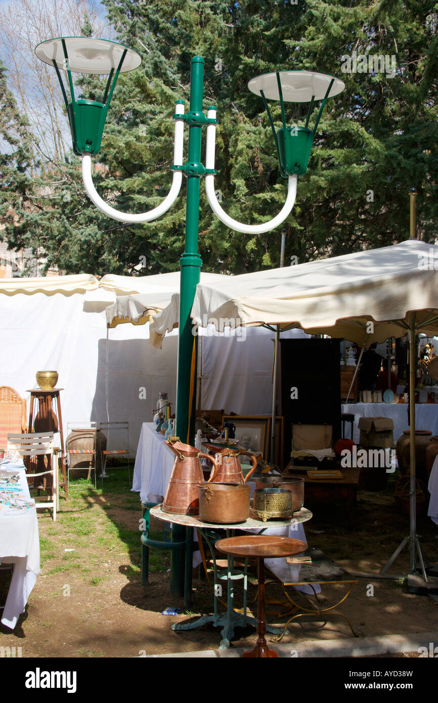 French street market selling bric-a-brac, brocante, and antique items ...