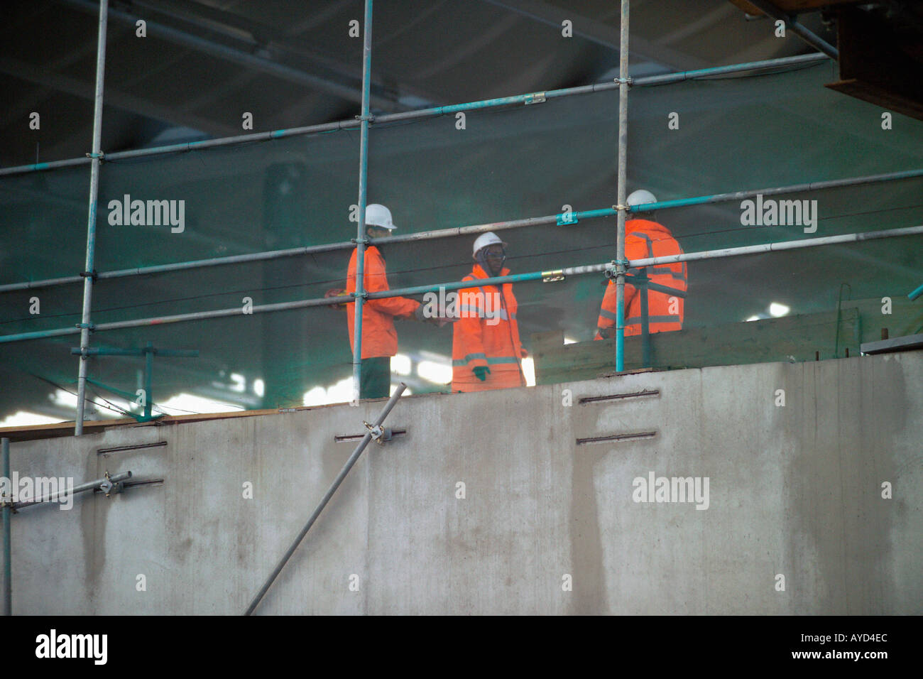 Builders on a construction site Stock Photo - Alamy