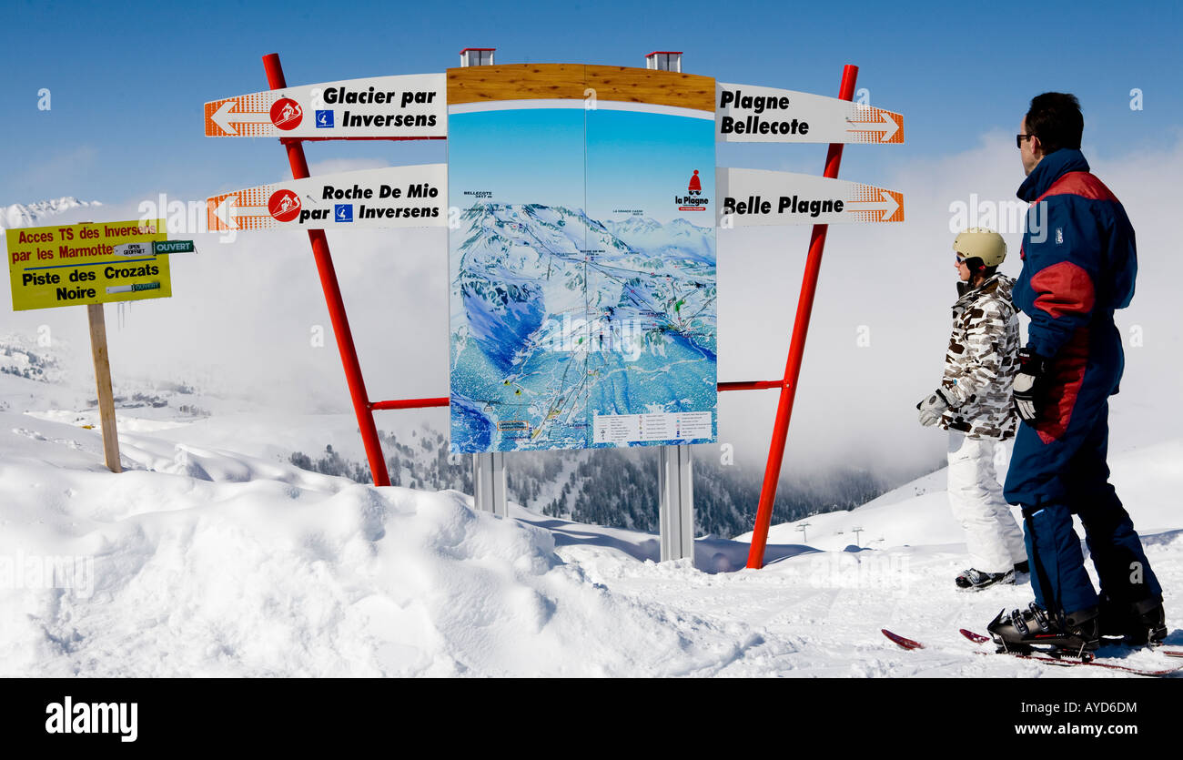Man Reading Piste Sign For Bellecote And Belle Plagne French Alps ...