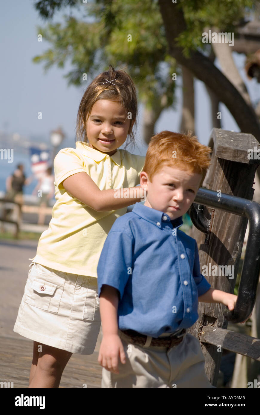 Portrait of children on railing Stock Photo - Alamy