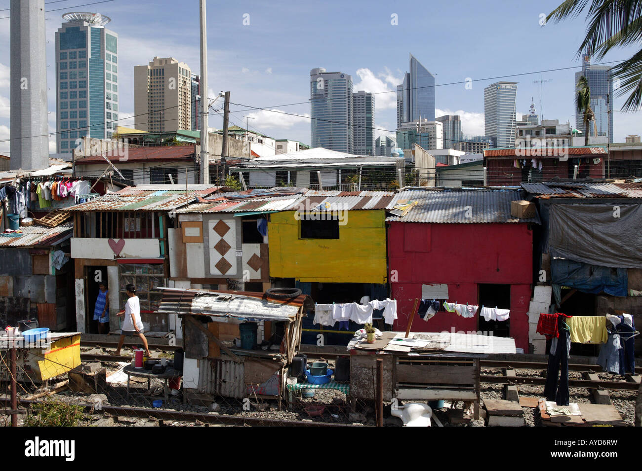 Manila, The Philippines: Slum huts in front of the skyline of the bank district Makati Stock ...