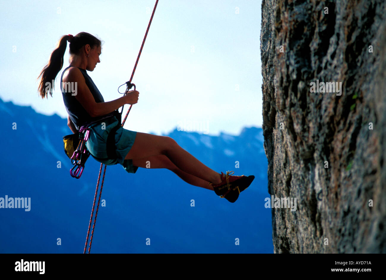 woman rock climber abseiling a rock face Stock Photo - Alamy