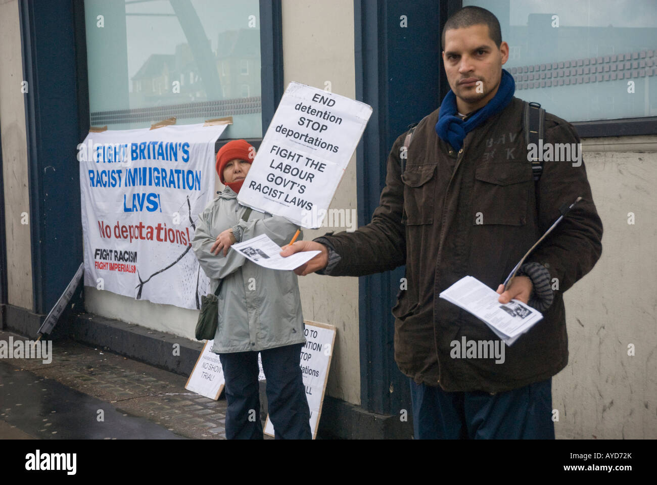Protesters with placards and banners call for rights for asylum seekers ...