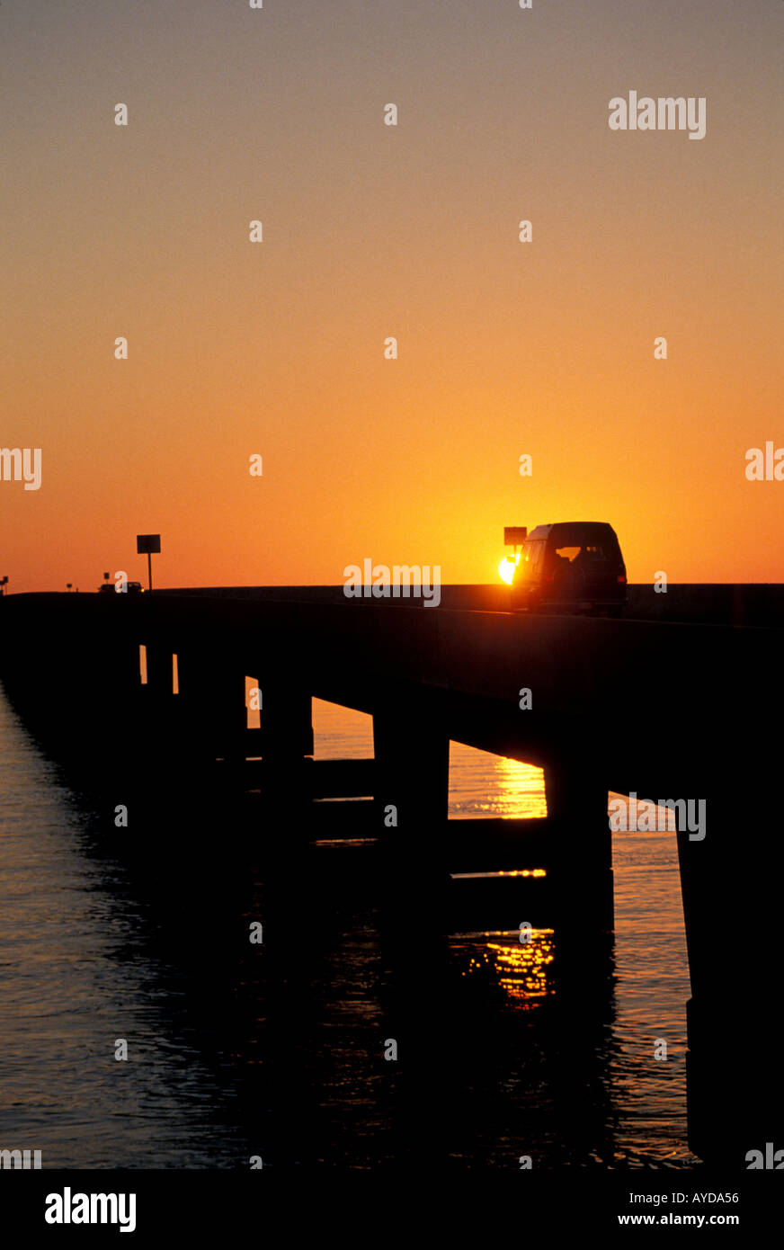 Florida Keys Cars driving into sunset on Overseas Highway Stock Photo ...
