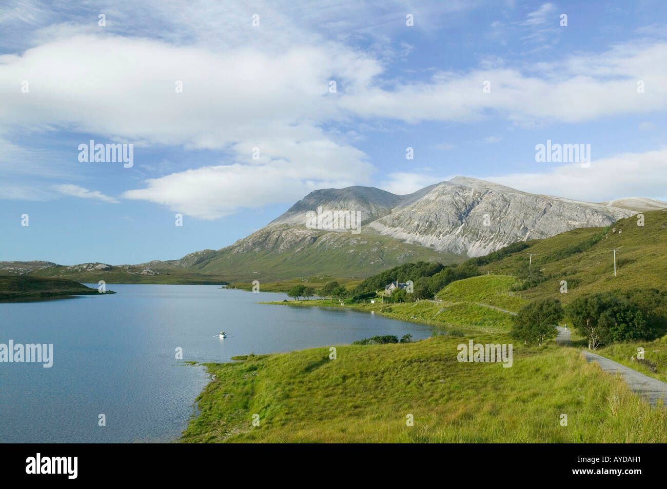Fly fishing on loch Stack with Arkle behind, Sutherland, Scotland, UK ...