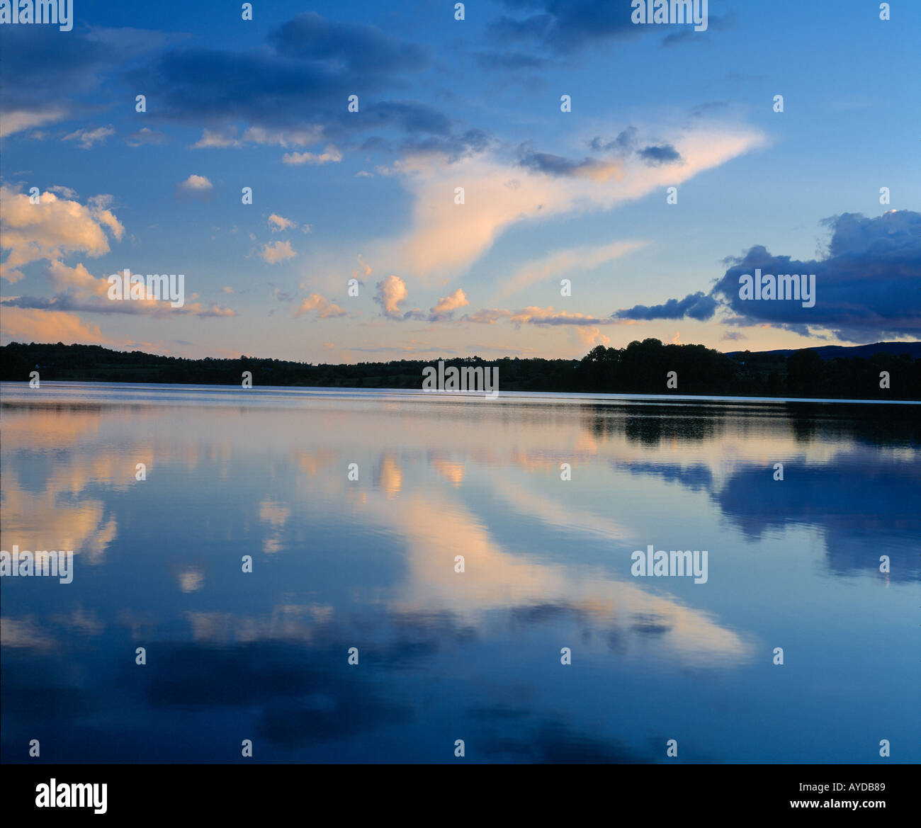 Dawn dusk reflected on a calm irish lake hi-res stock photography and ...