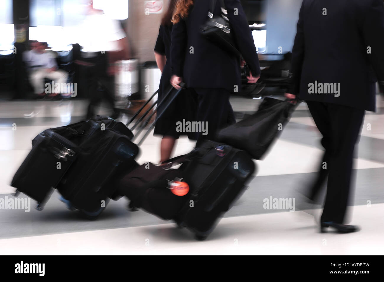 Travelers in motion rushing through an airport Stock Photo - Alamy