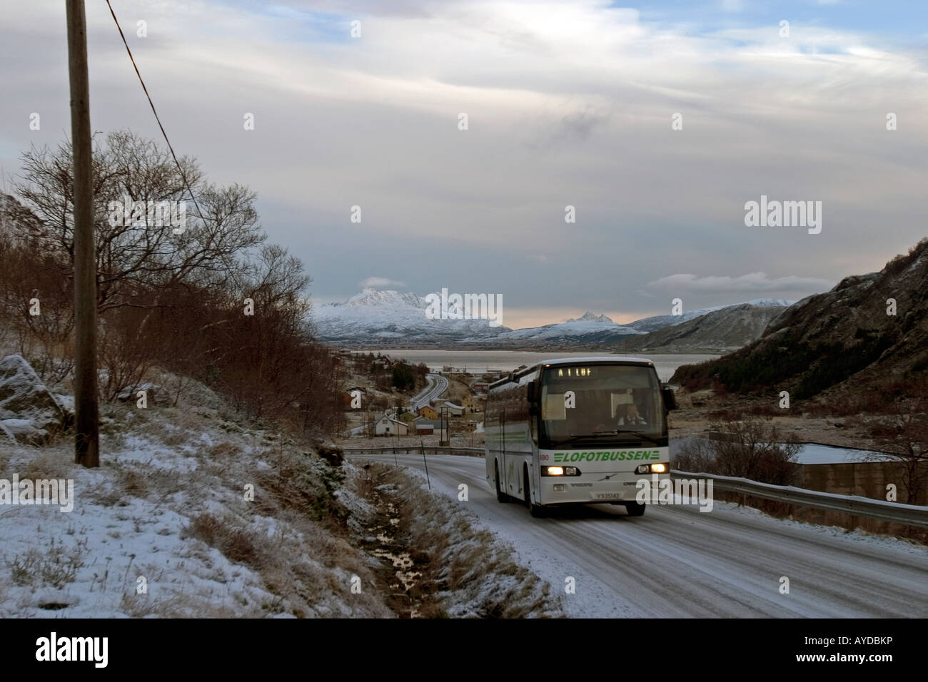 Bus (Coach) driving on snow covered road in lofoten, Nordland, Northern ...