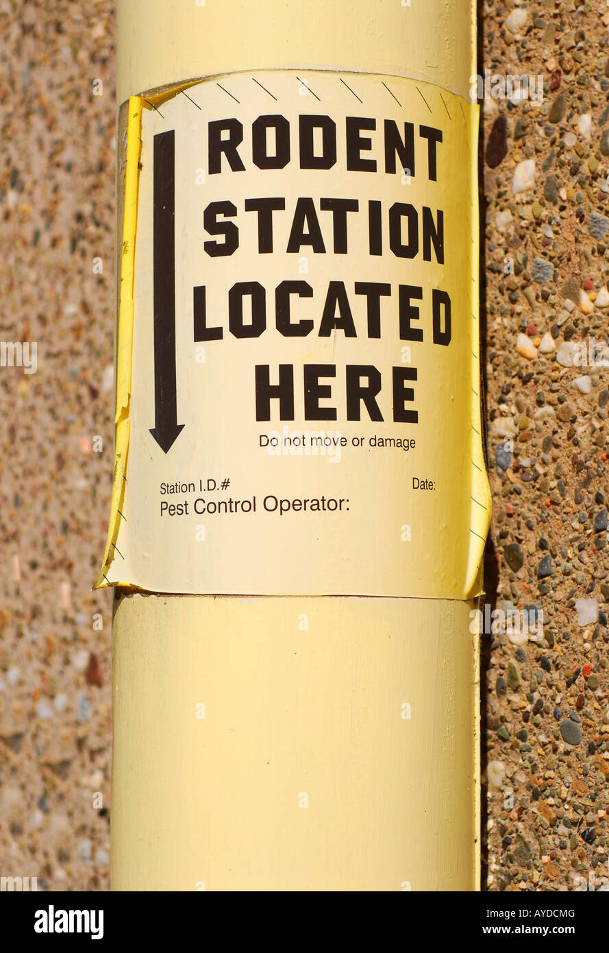 Sign reading Rodent Station Located Here on a pole Stock Photo - Alamy
