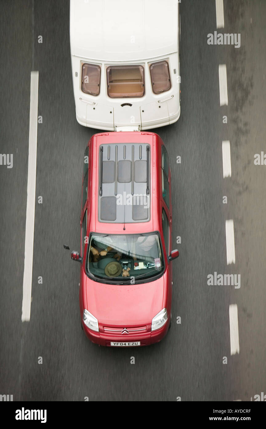 car towing a caravan driving on a road into Hull, Yorkshire, UK Stock ...