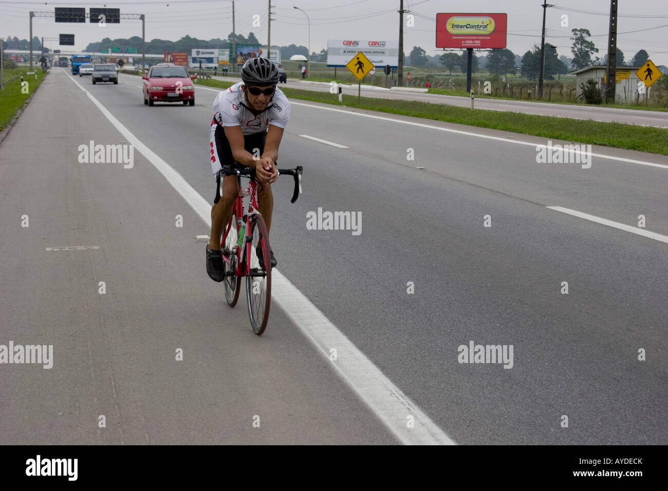 Cycling by the road Stock Photo - Alamy