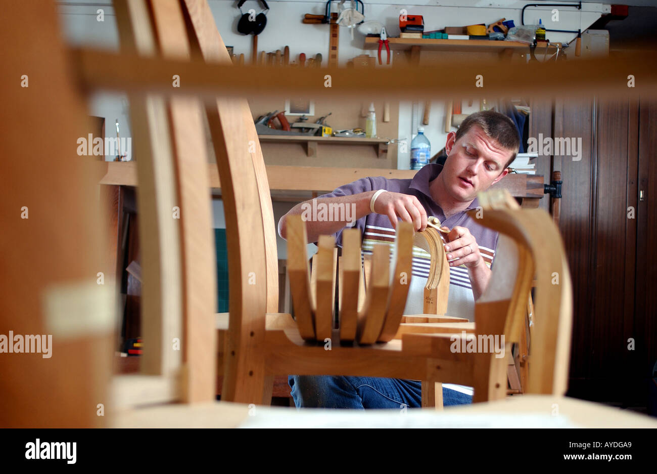 a cabinet maker using tools and working in his studio Stock Photo - Alamy
