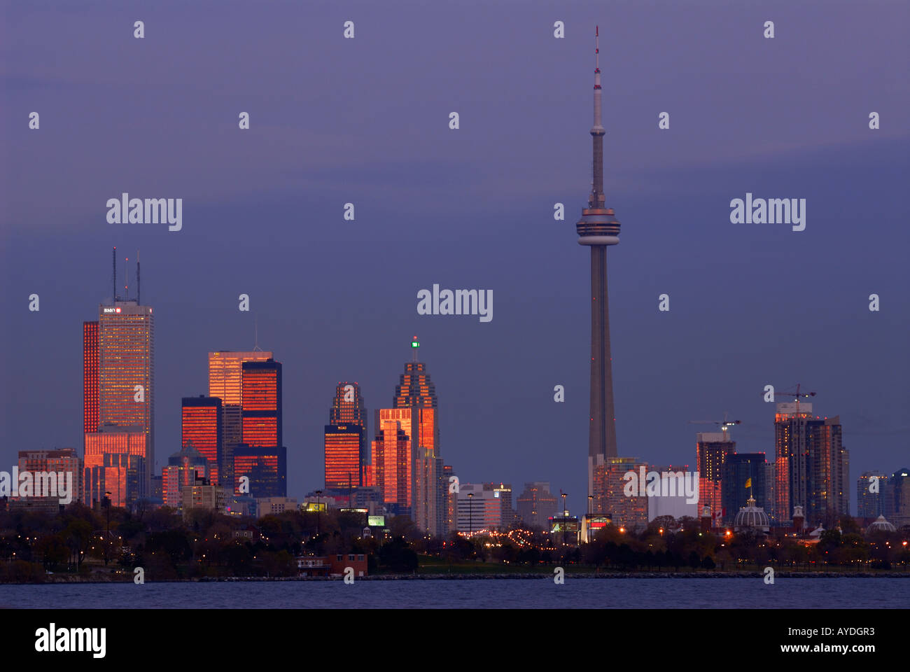 Toronto towers reflecting the golden glow of a red sunset Stock Photo ...