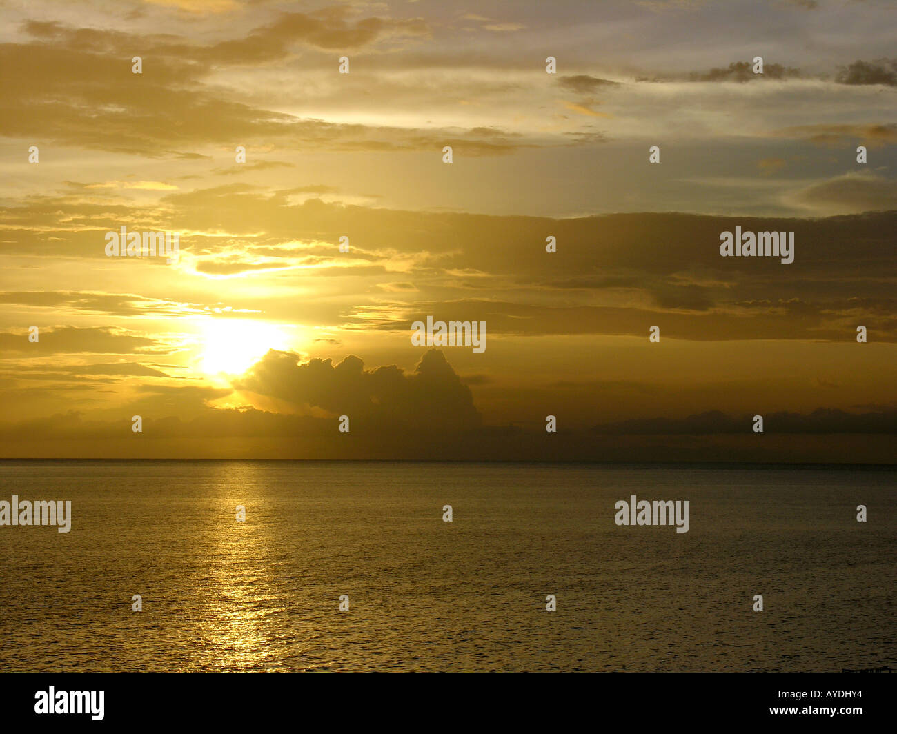 The sun sets of the Caribbean Sea off the coast of Roseau the capital ...