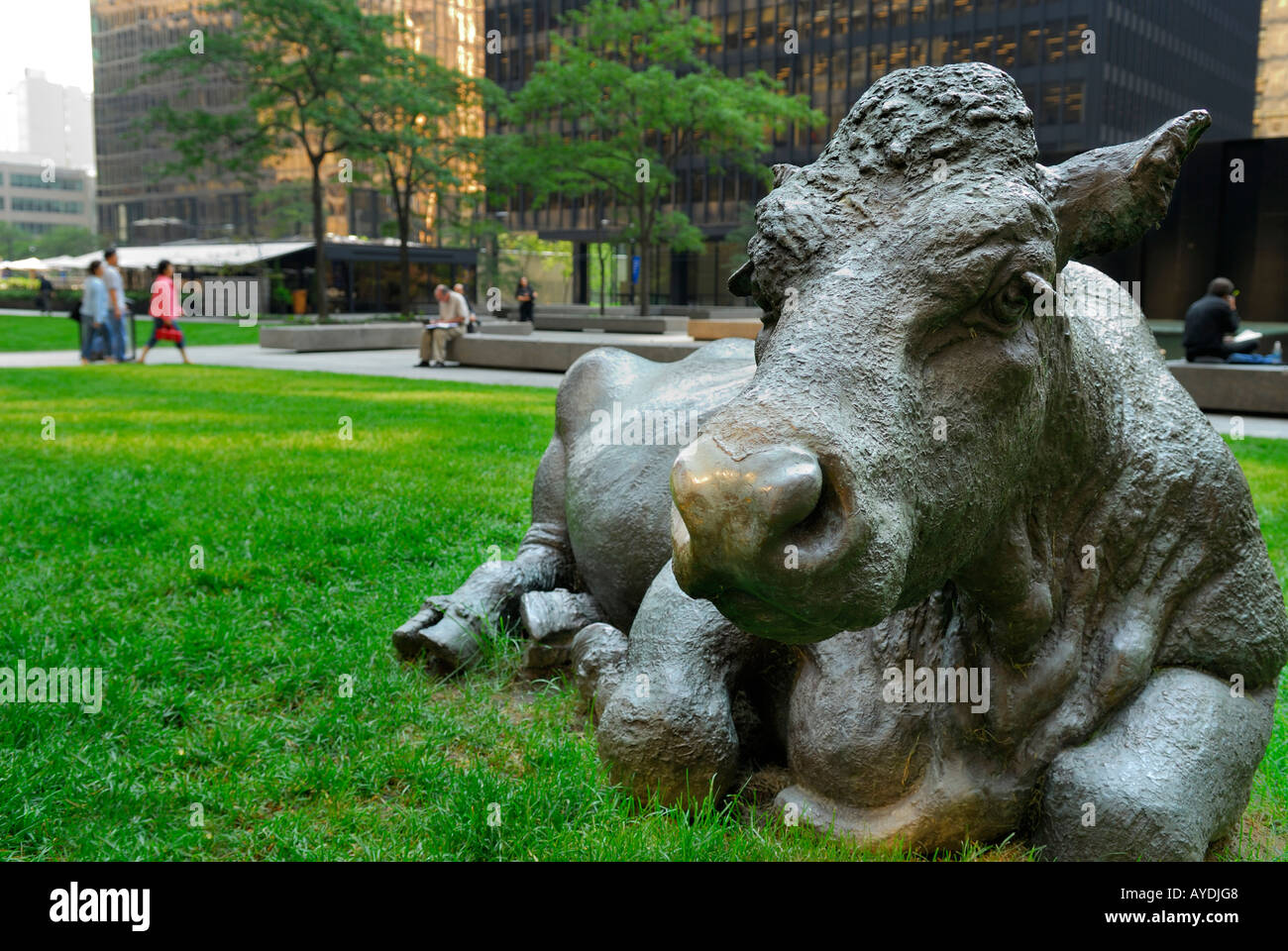 Bronze sculpture of a Bull lying in the grass in Financial district of ...