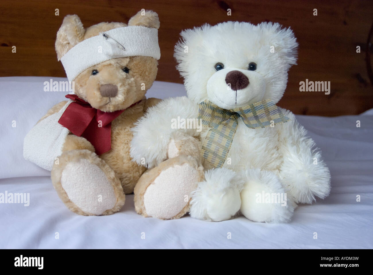 Sick teddy bear with friend Stock Photo - Alamy