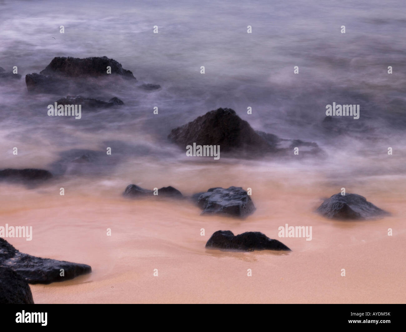 Rocks in the water and on the beach, Poipu, Kauai, Hawaii Stock Photo ...