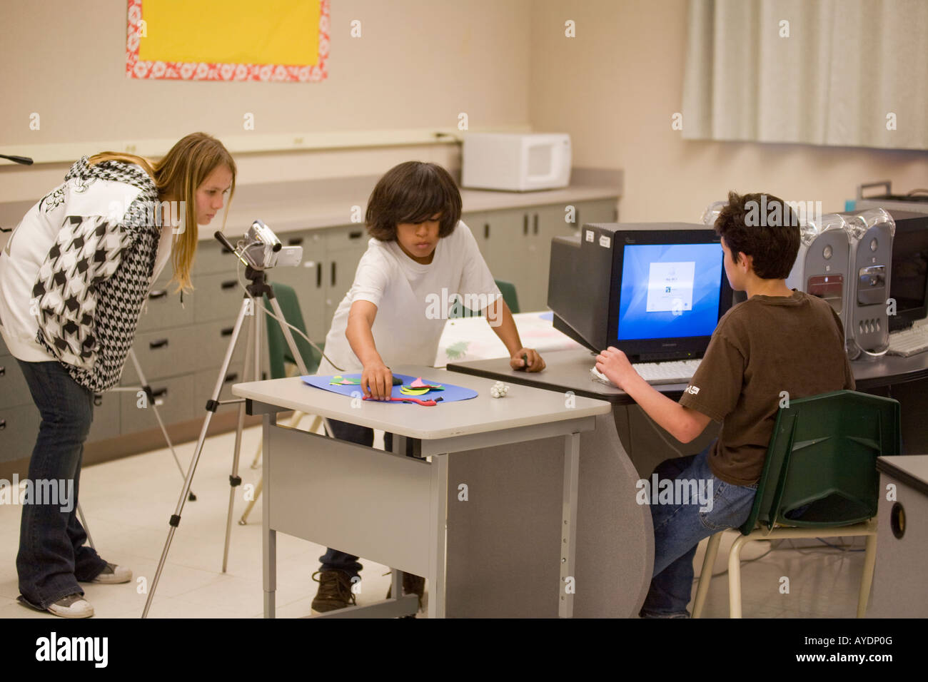 Caucasian and Hispanic students in middle school computer class Stock ...
