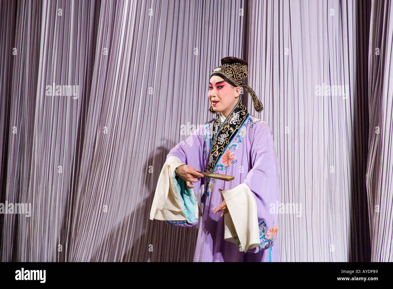Chinese singer singing onstage in a performance of the Beijing opera in ...