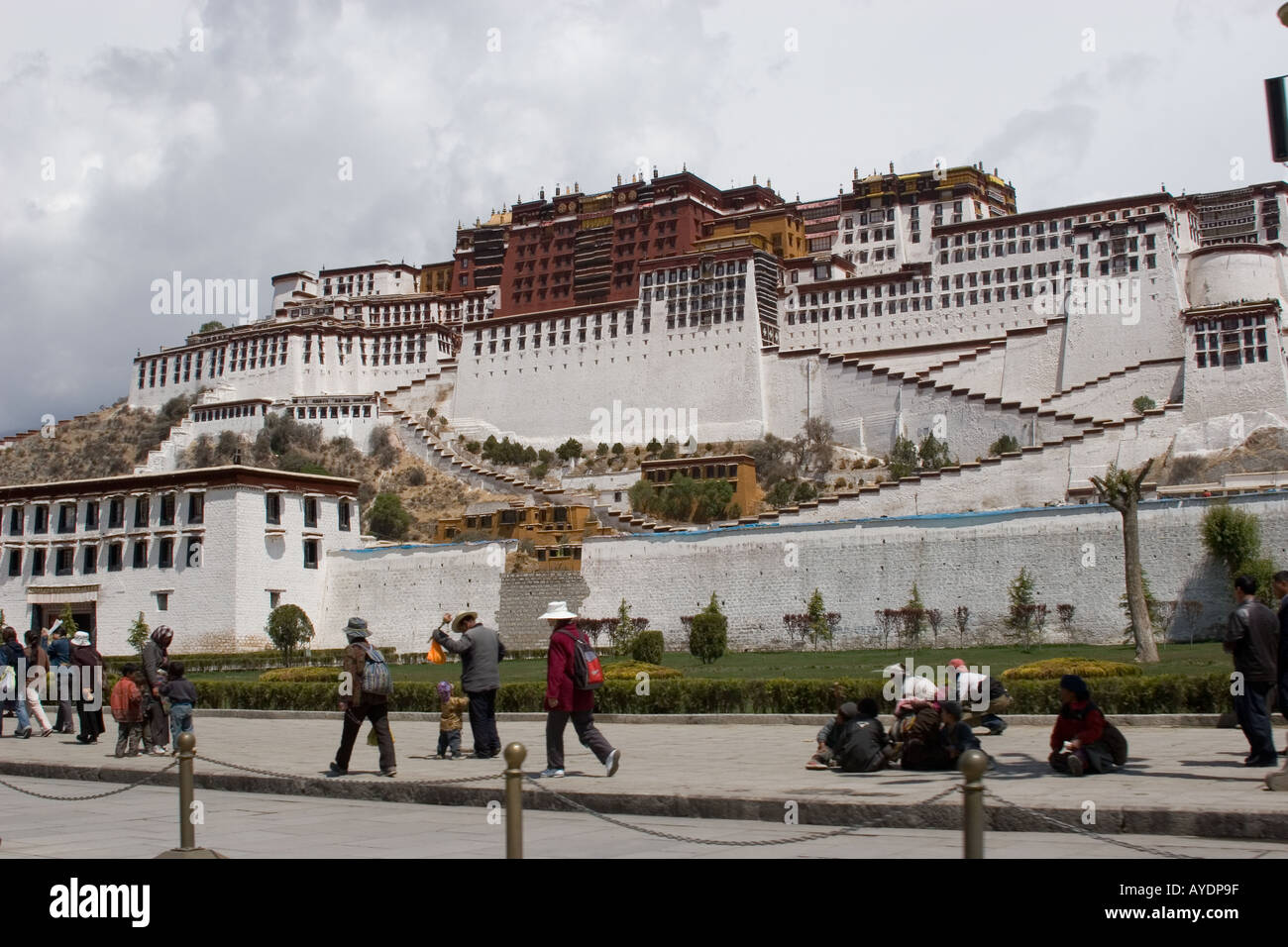 Tibetan pilgrims walking in front of the Dali Lama's Potala Palace in ...