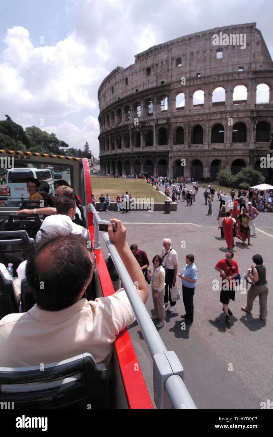 Rome tourists on open top bus at the Roman coliseum Stock Photo - Alamy