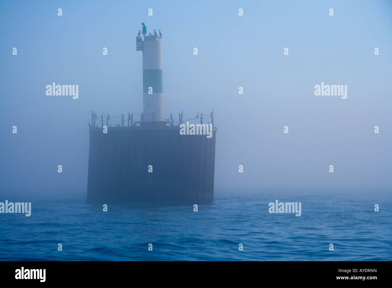 Lighthouse in heavy fog Stock Photo - Alamy