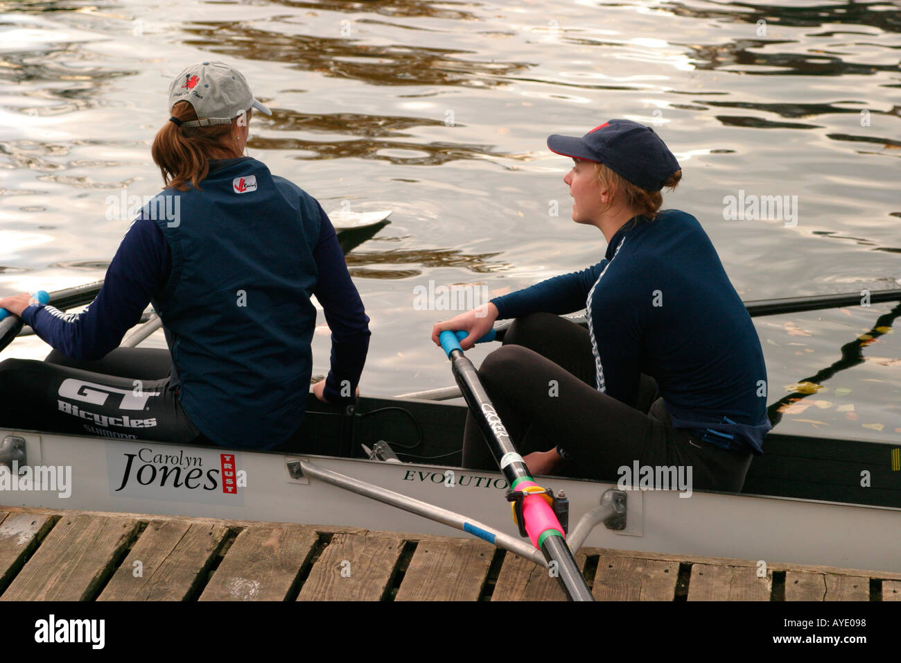 Young female rowers in two person skiff on river thames england uk ...