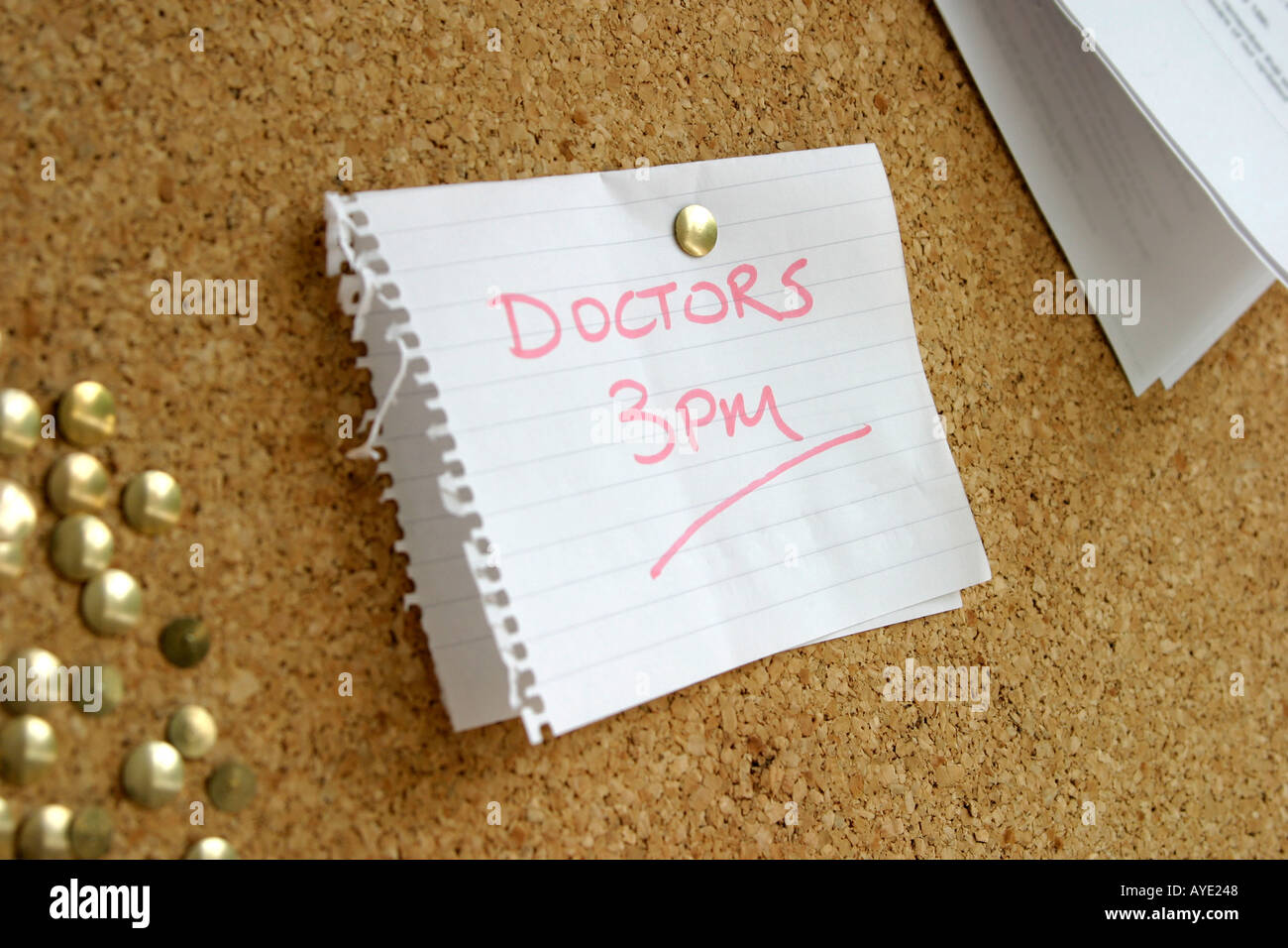 LANDSCAPE SHOT OF REMINDER OF DOCTORS APPOINTMENT ON WHITE PIECE OF ...