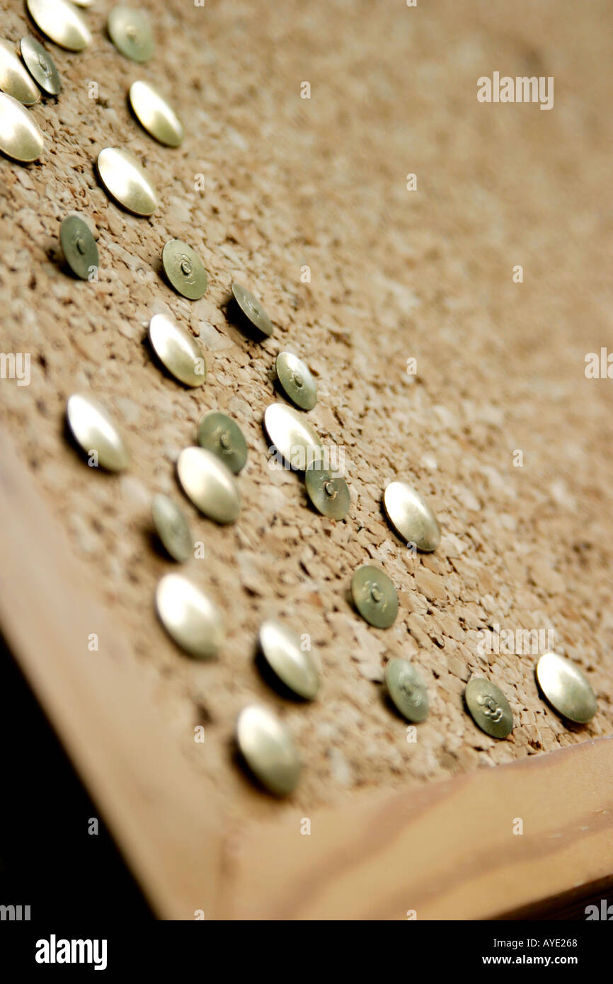 PORTRAIT SHOT OF CORNER OF NOTICE BOARD SHOWING WOODEN EDGE CORK ...