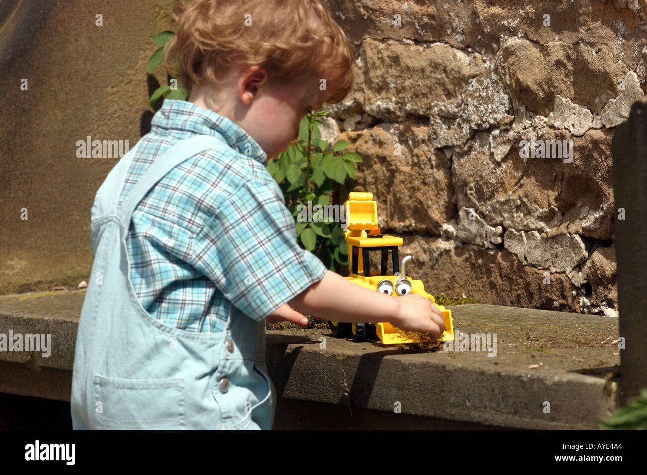 Newstead Abbey Lewis aged two playing with his Scoop model back hoe ...