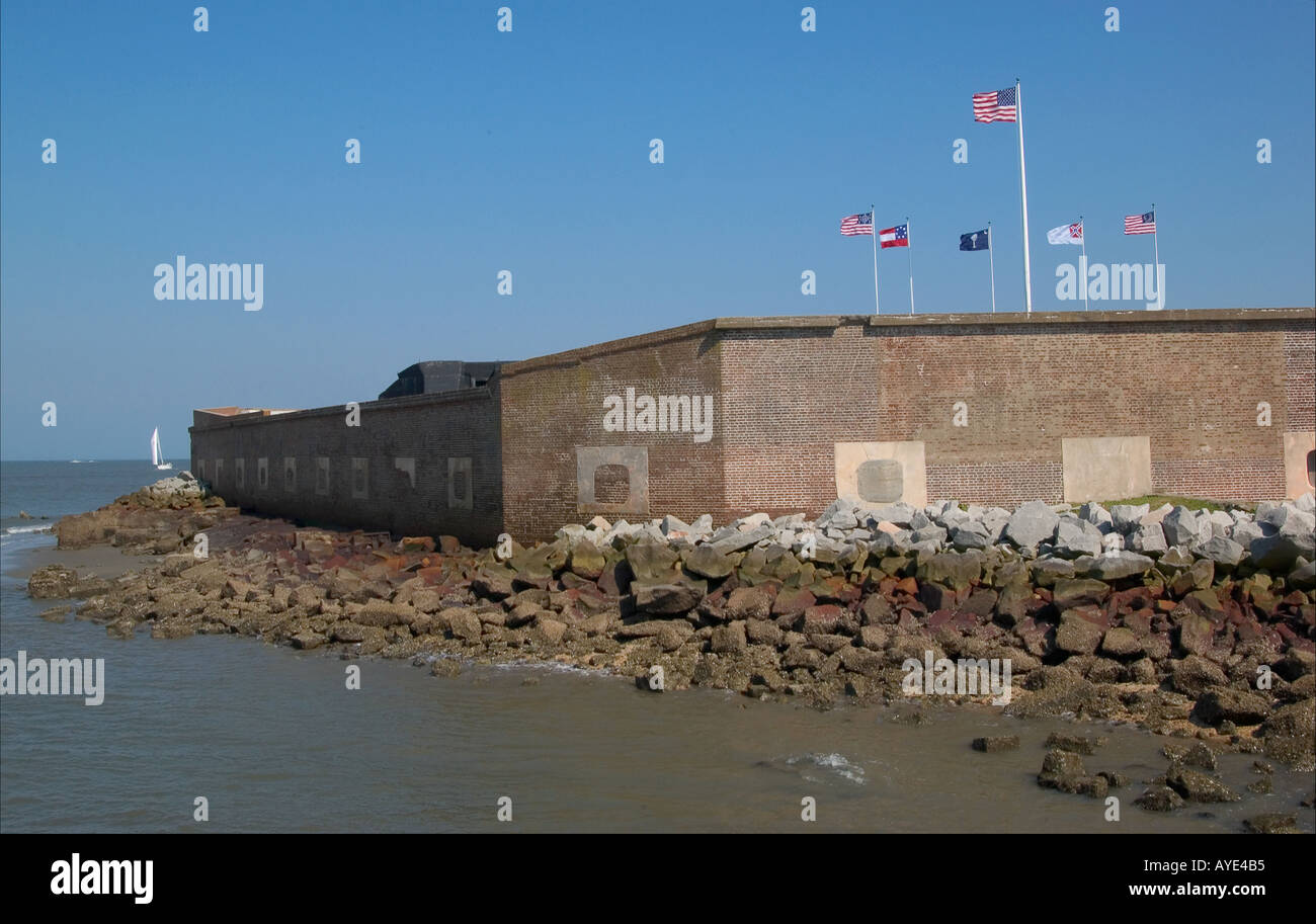 Historic brick building with American flags flying above at Fort Sumter ...