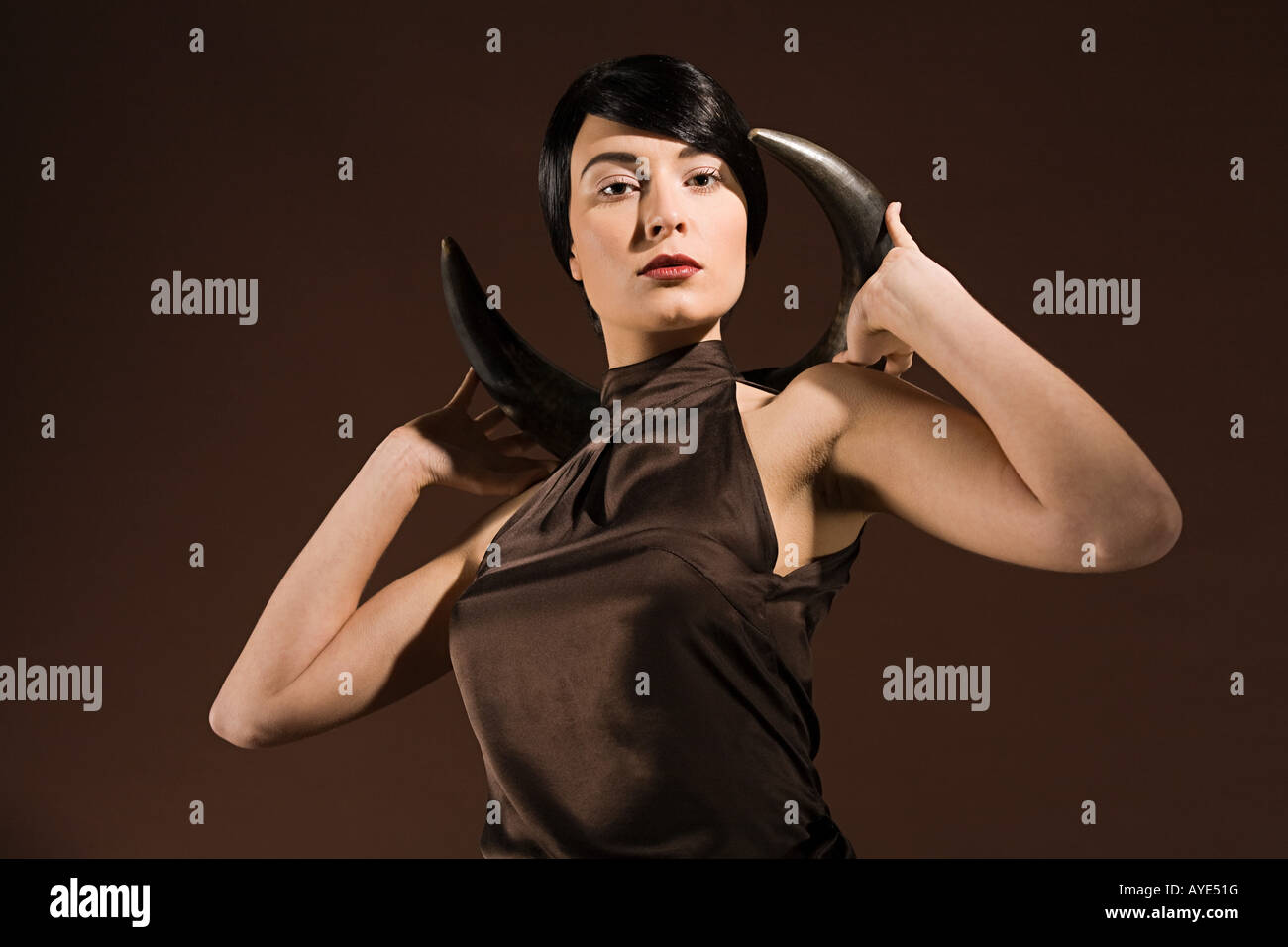 Young woman with animal horn Stock Photo - Alamy