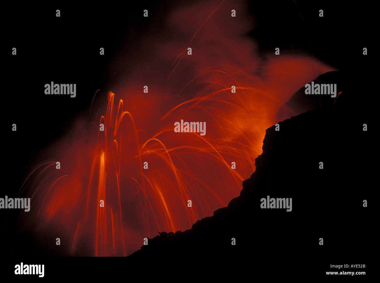 Lava exploding at night while flowing into ocean Kilauea volcano Hawaii ...
