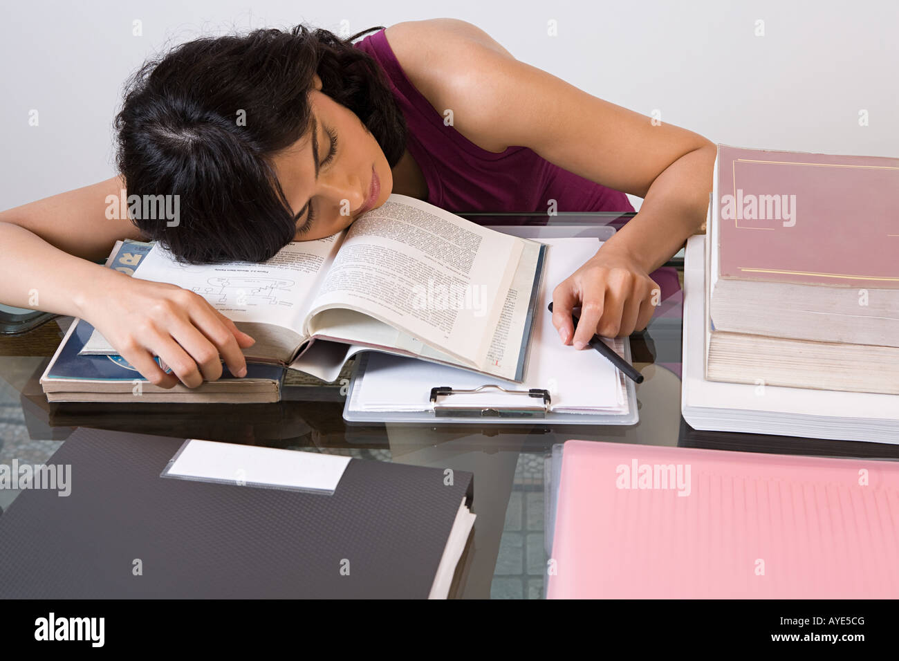 A woman tired from studying Stock Photo - Alamy