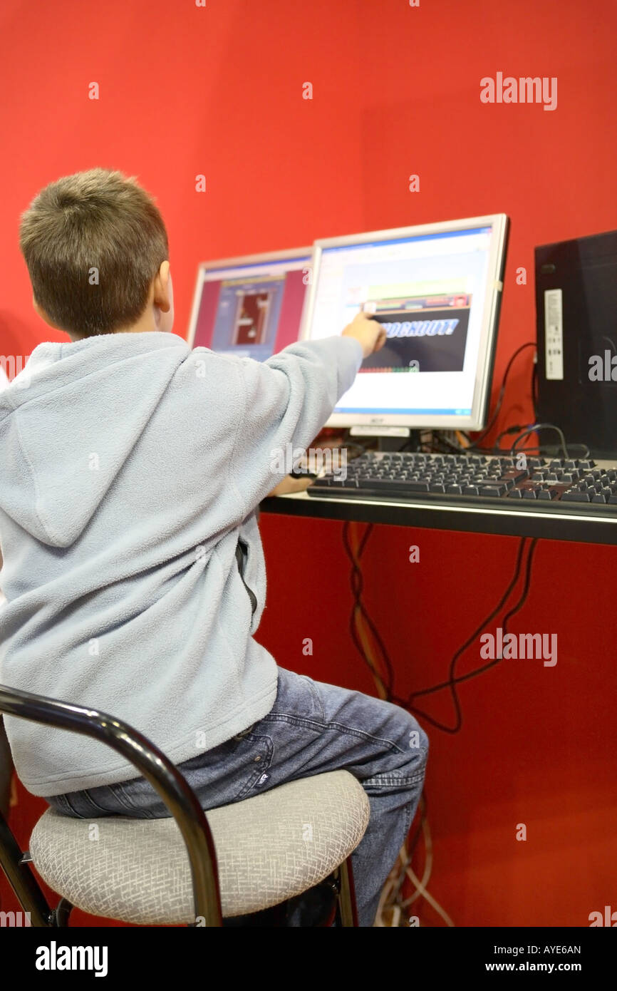Boy point up on screen Stock Photo - Alamy
