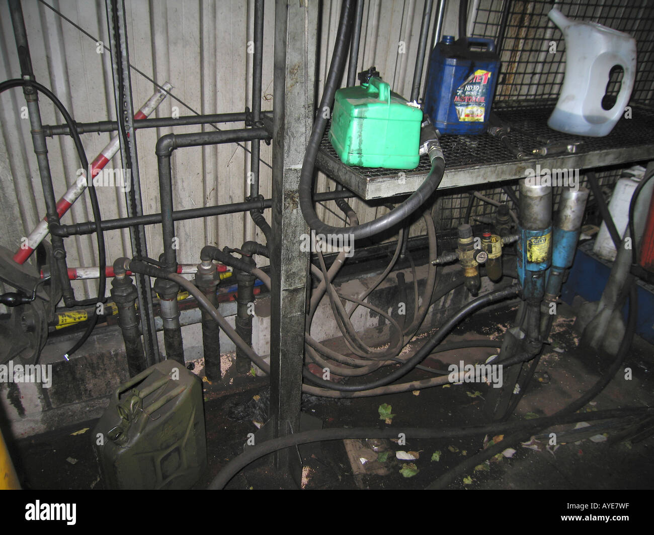 Oil and lubricant storage within garage vehicle workshop Stock Photo ...