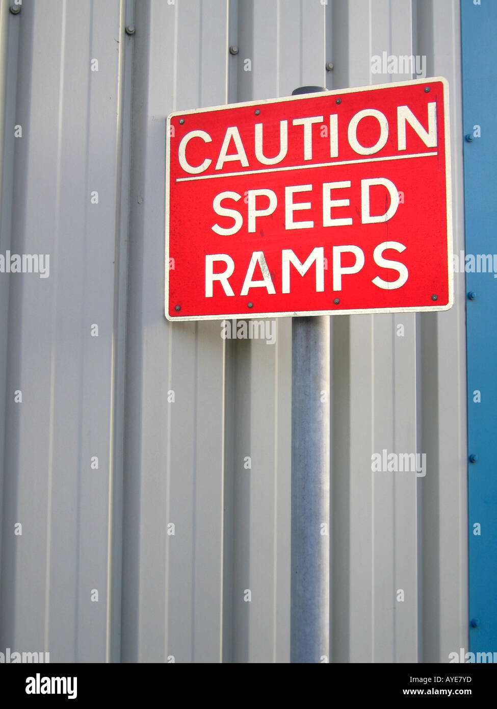 Speed bump warning sign Stock Photo - Alamy
