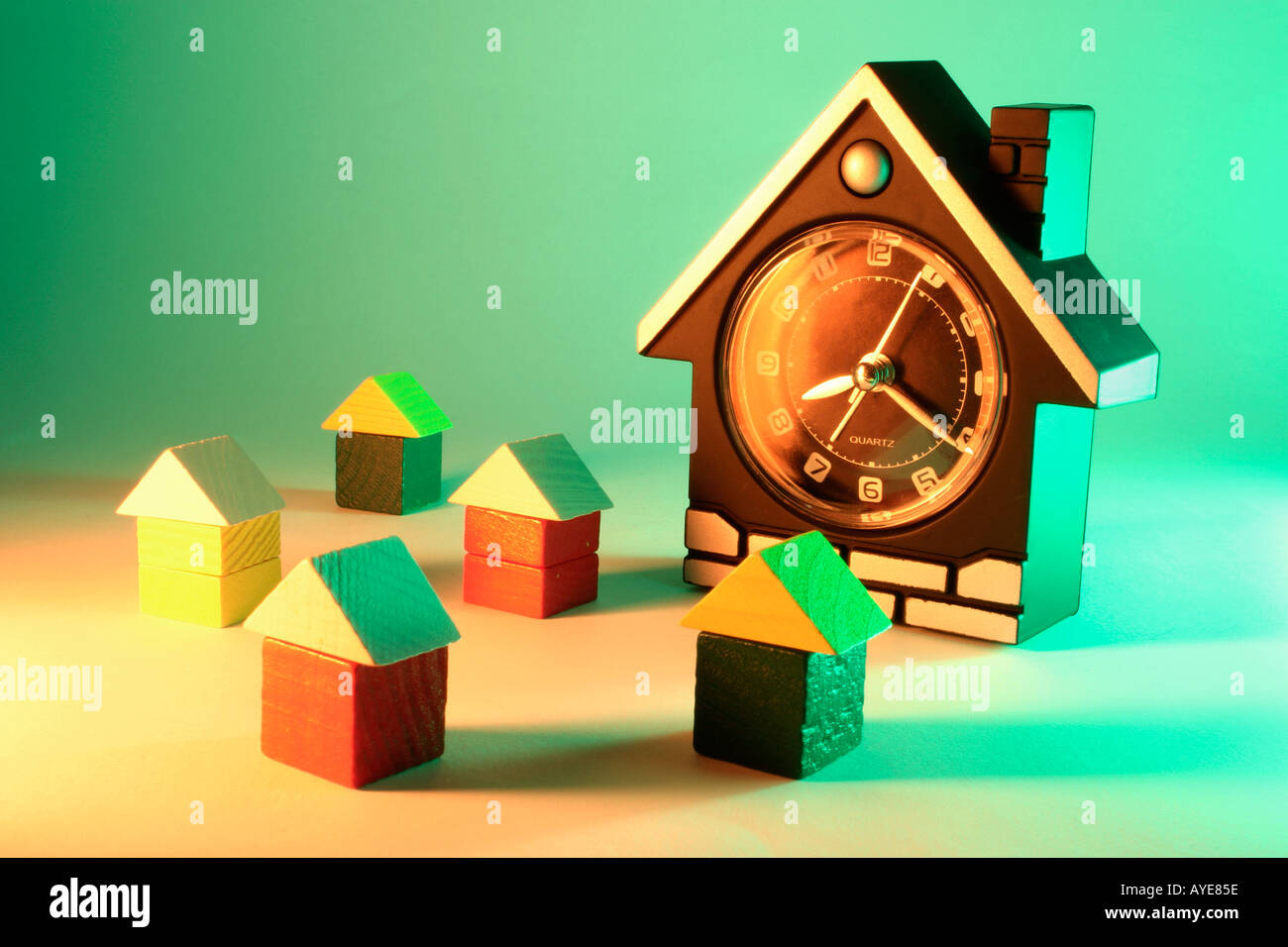 Wooden House Symbols and House-shaped Clock Stock Photo - Alamy