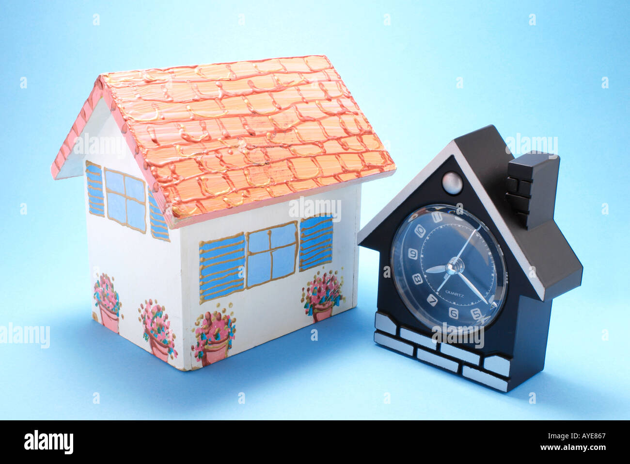 Toy House and House-shaped Clock Stock Photo - Alamy