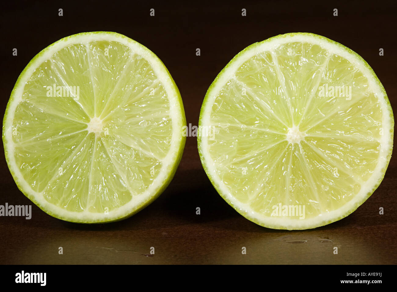 Lime cut in half Stock Photo - Alamy